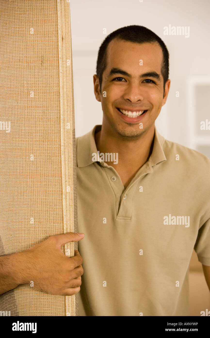 Man carrying rolled carpet hi-res stock photography and images - Alamy