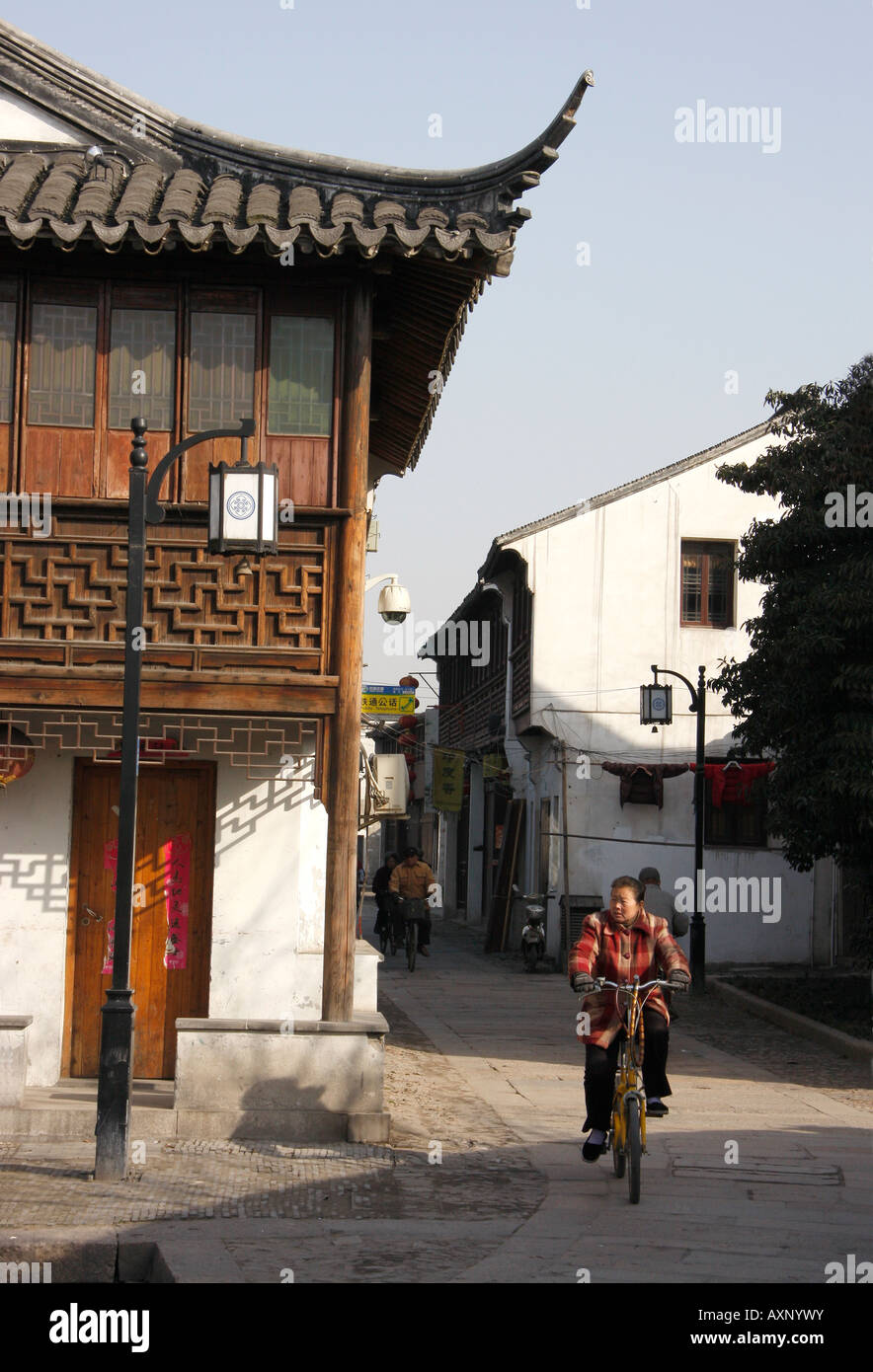Chinese woman cycling in the 'old town' of Suzhou,China Stock Photo - Alamy