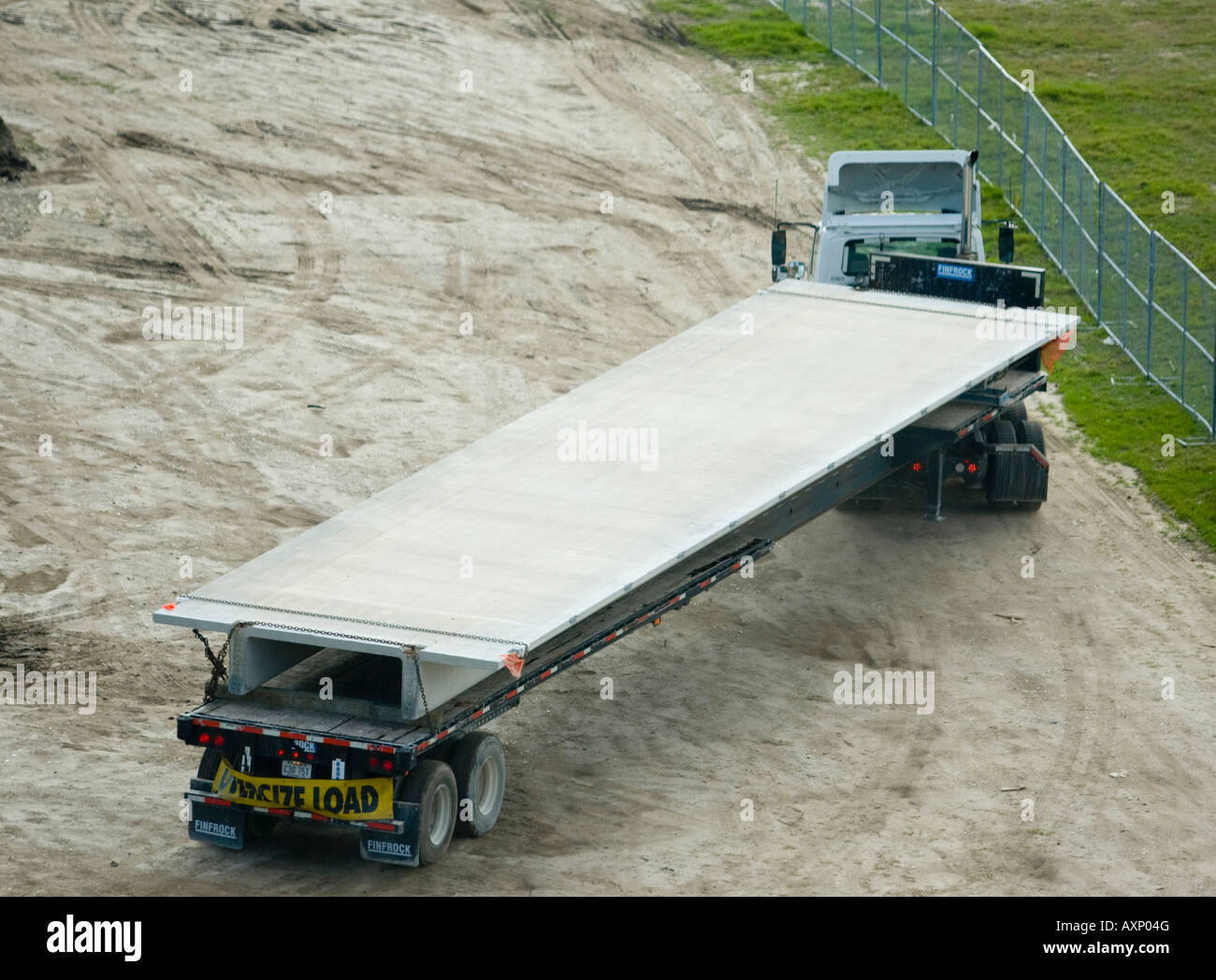 Trailer carrying a section of roadway Stock Photo - Alamy