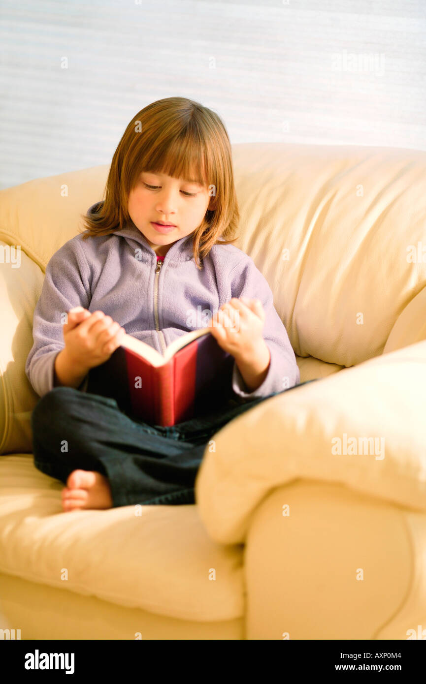 Child reading a book Stock Photo - Alamy