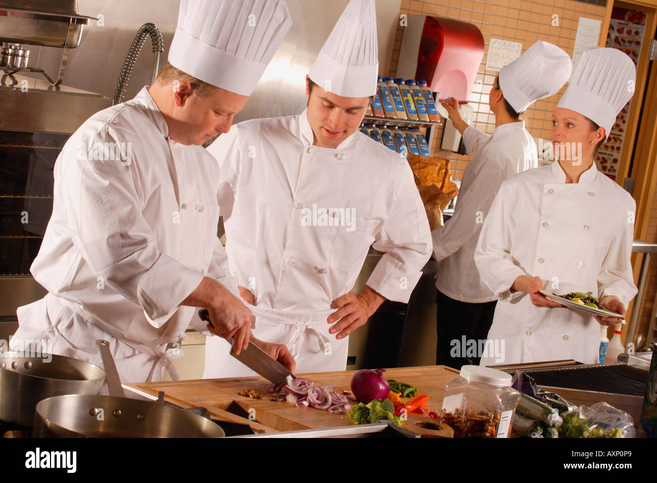 Chefs cooking in the kitchen Stock Photo - Alamy