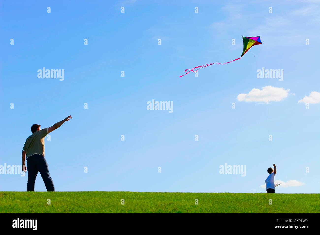 Father and son flying a kite Stock Photo - Alamy