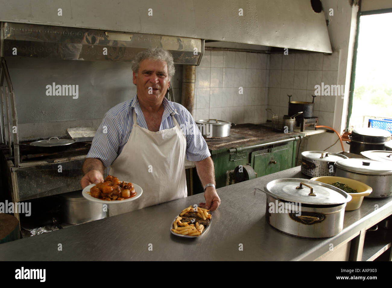 greece greek food and drink ionian corfu a chef in his kitchen with ...