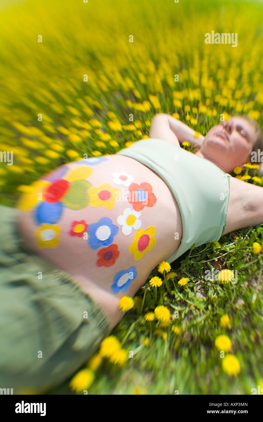 Painted pregnant belly flower hi-res stock photography and images - Alamy