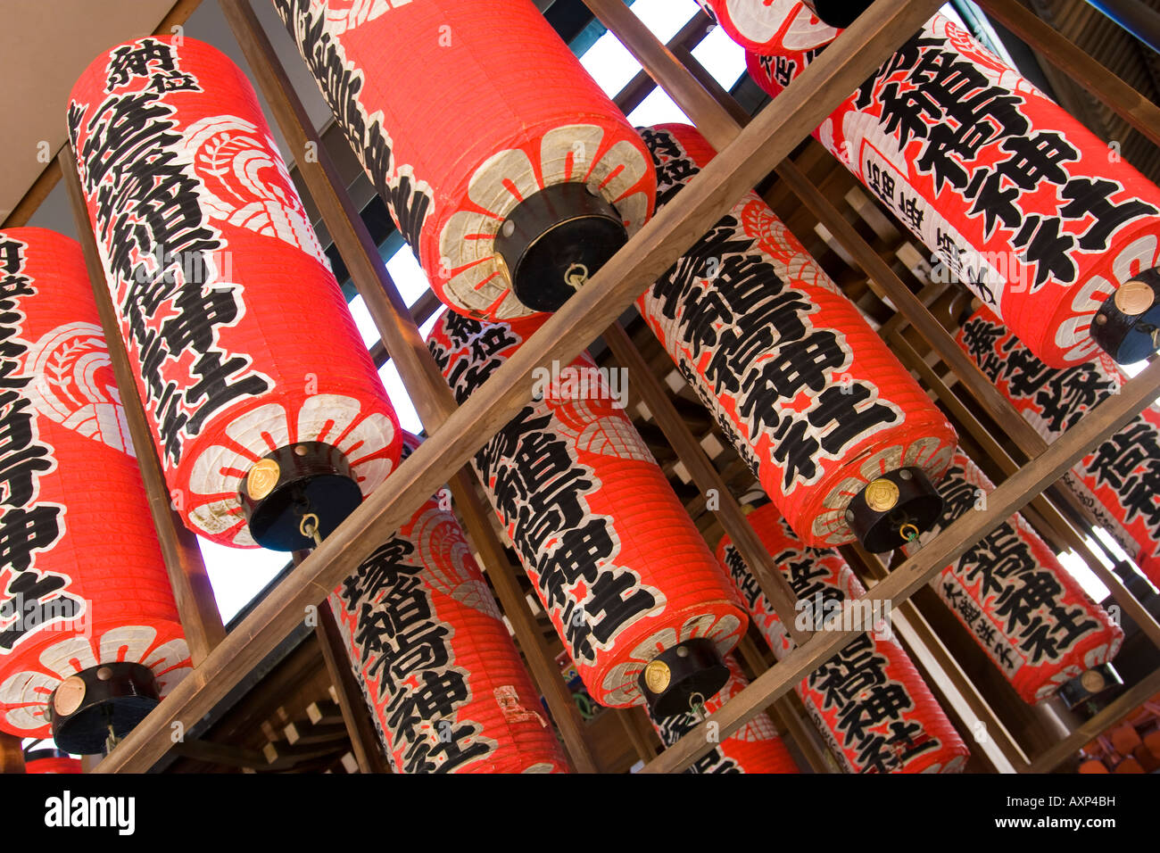Rows of red paper lanterns with Japanese characters Stock Photo - Alamy