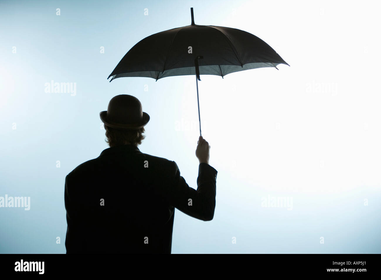 Person holding umbrella Stock Photo - Alamy