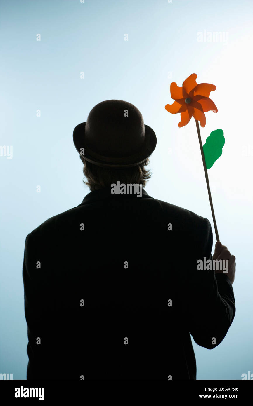 Person holding a flower pin wheel Stock Photo - Alamy