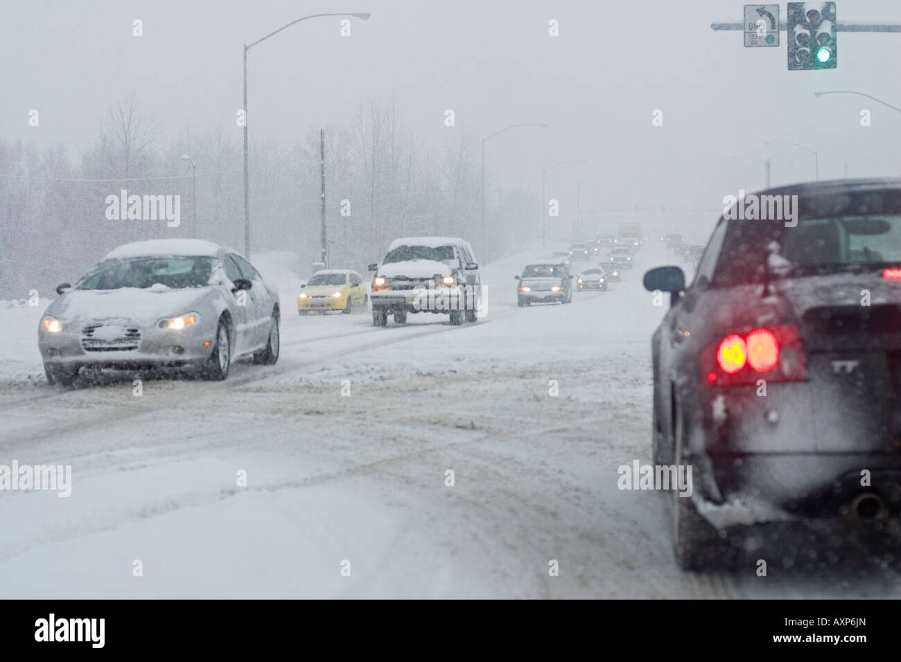 Traffic at an intersection on Tudor Road during a snow storm in ...