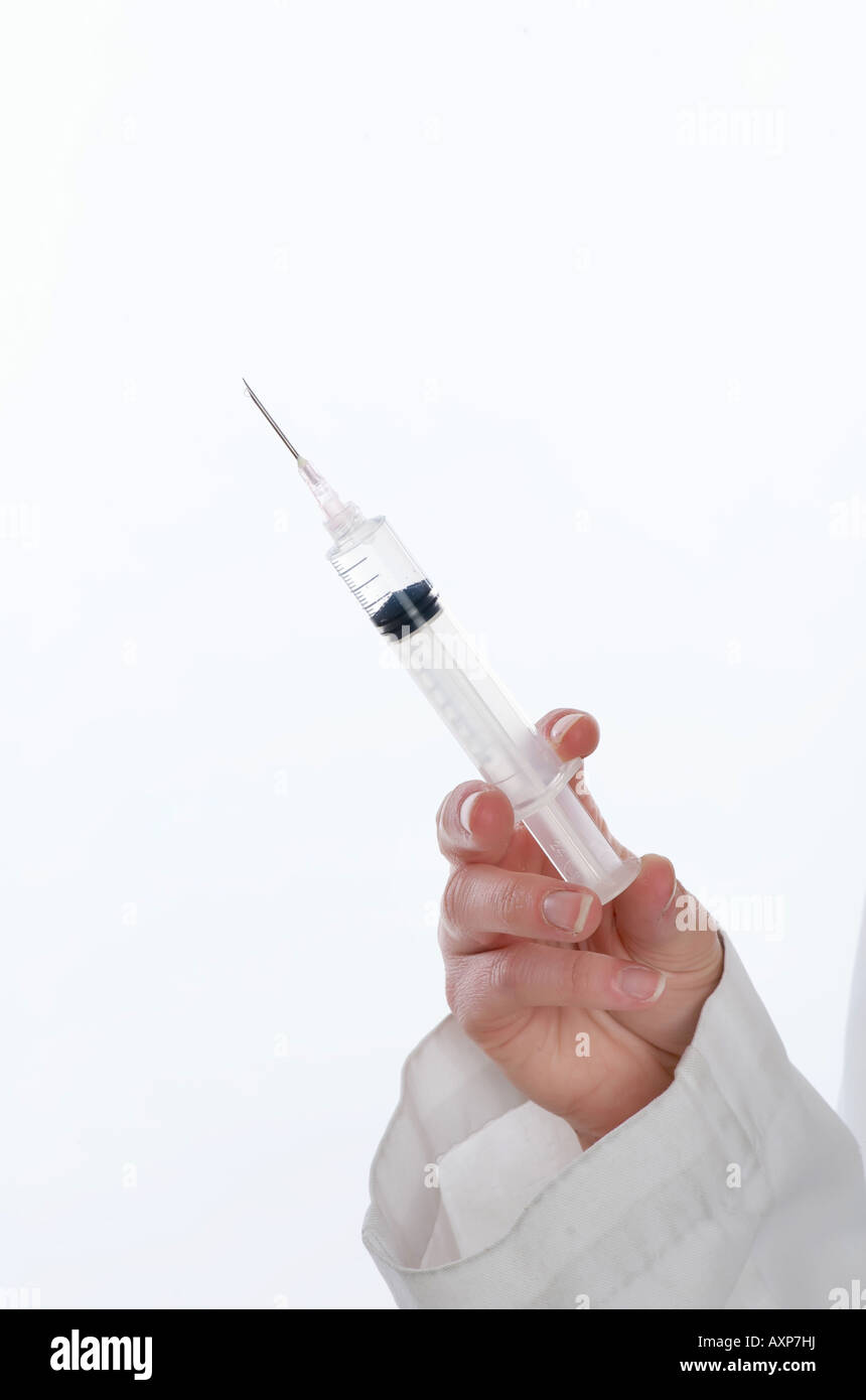 Image of a female doctor's hand holding syringe close up on white Stock ...