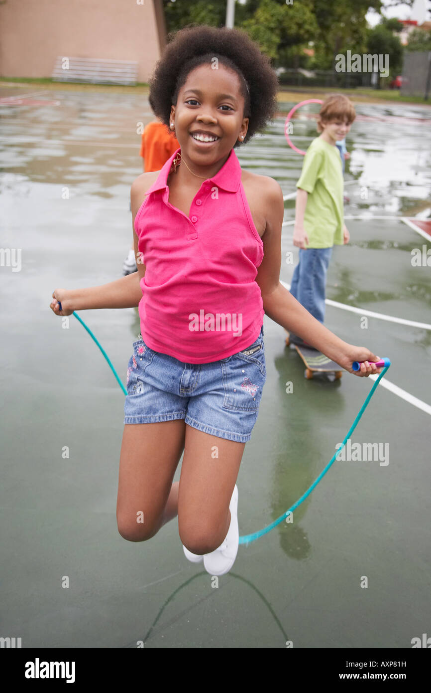 Girl jumping rope hi-res stock photography and images - Alamy