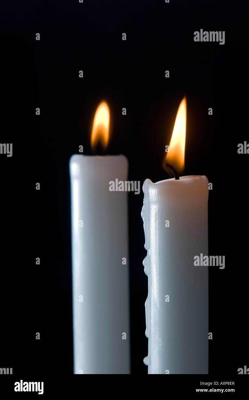 Two candles burn Stock Photo - Alamy