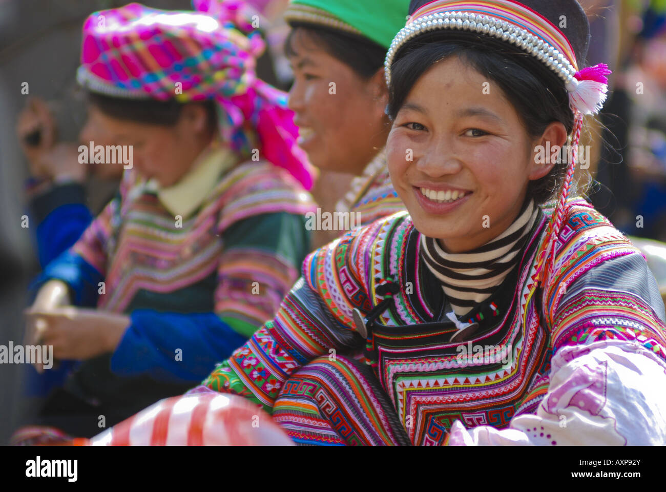 A young woman from the Hani ethnic minority in a market in Yunnan ...