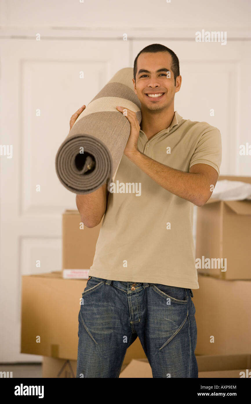 Man carrying rolled carpet hi-res stock photography and images - Alamy