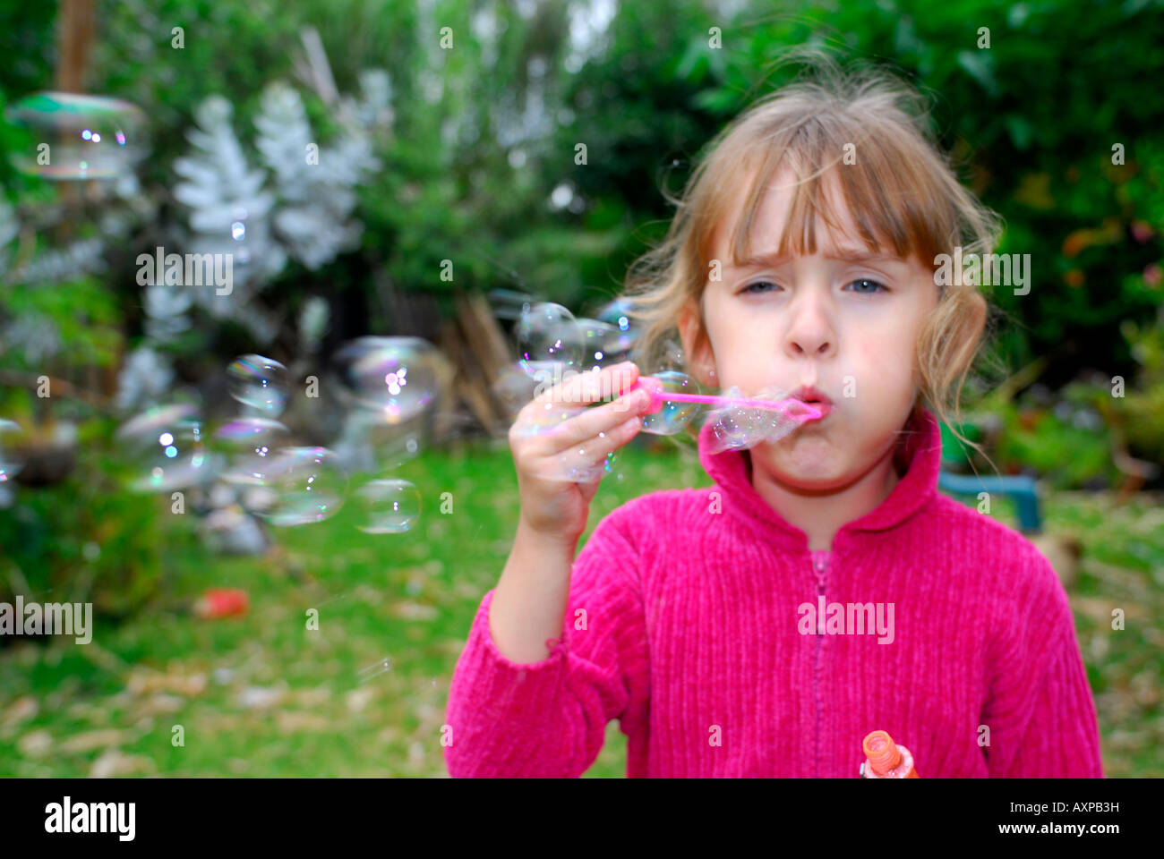 Child blowing soap bubbles Stock Photo - Alamy Child blowing soap bubbles Stock Photo - Alamy