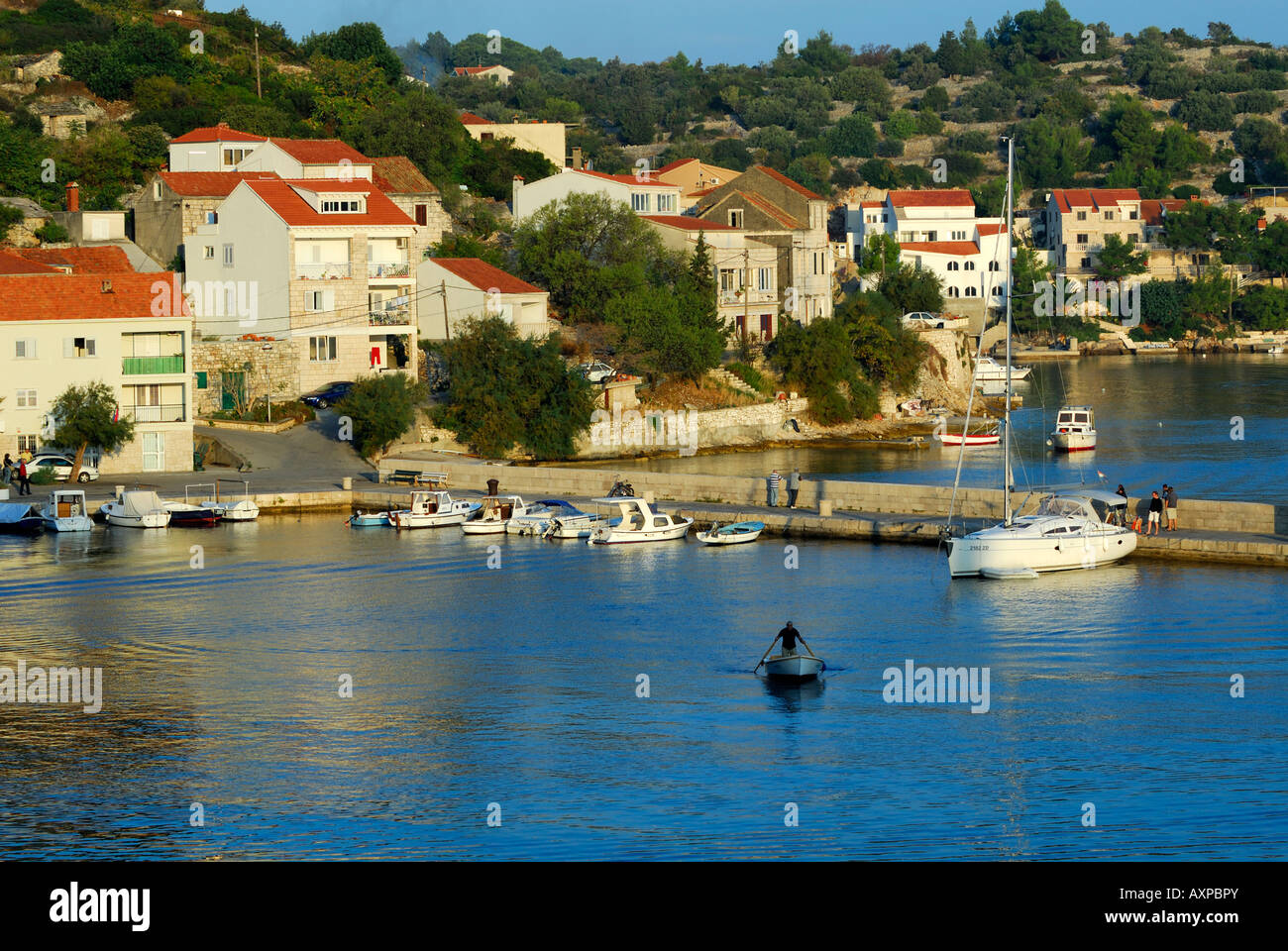 Man in rowboat, village of Racisce, island of Korcula, Croatia Stock ...