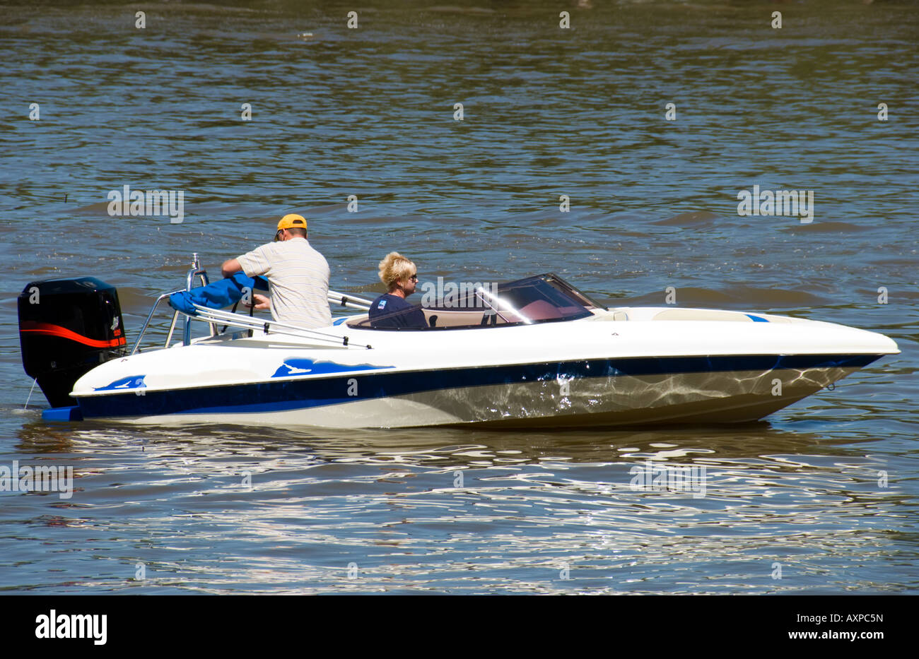 Man and Woman on speedboat on River Stock Photo - Alamy