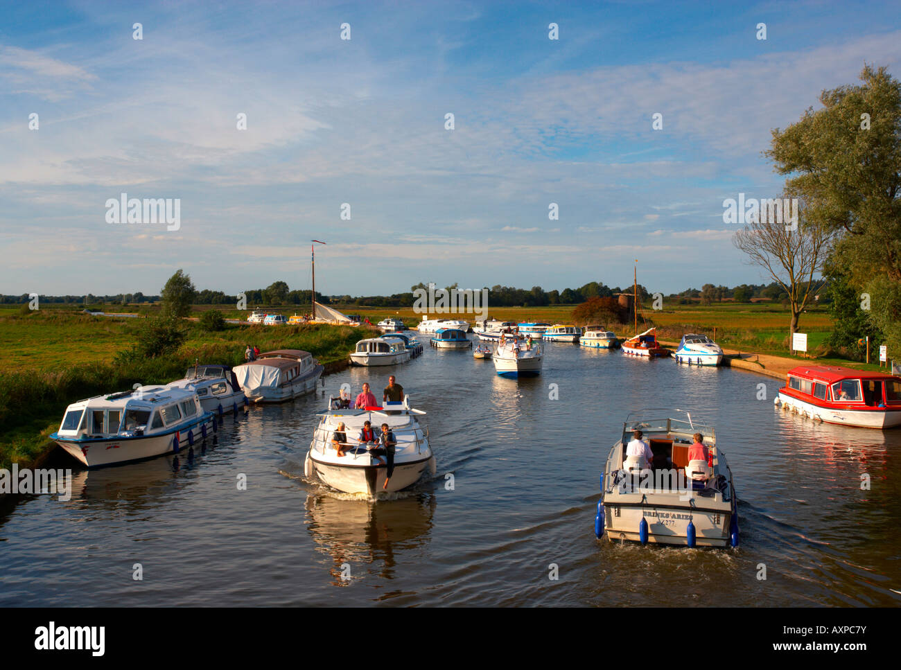 A busy evening at Ludham Bridge on the River Ant in the Norfolk Broads ...