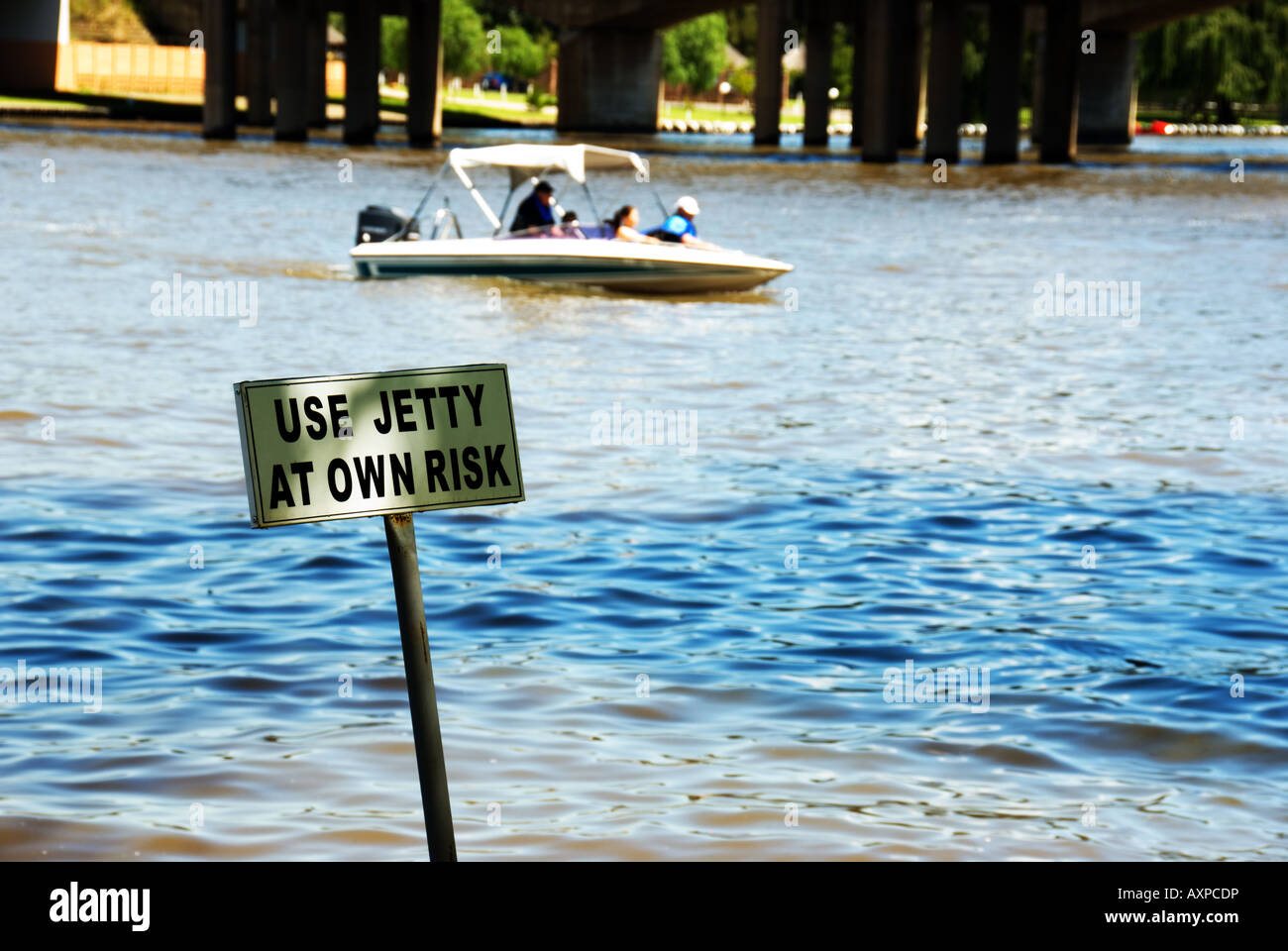 Sign at water edge Stock Photo - Alamy