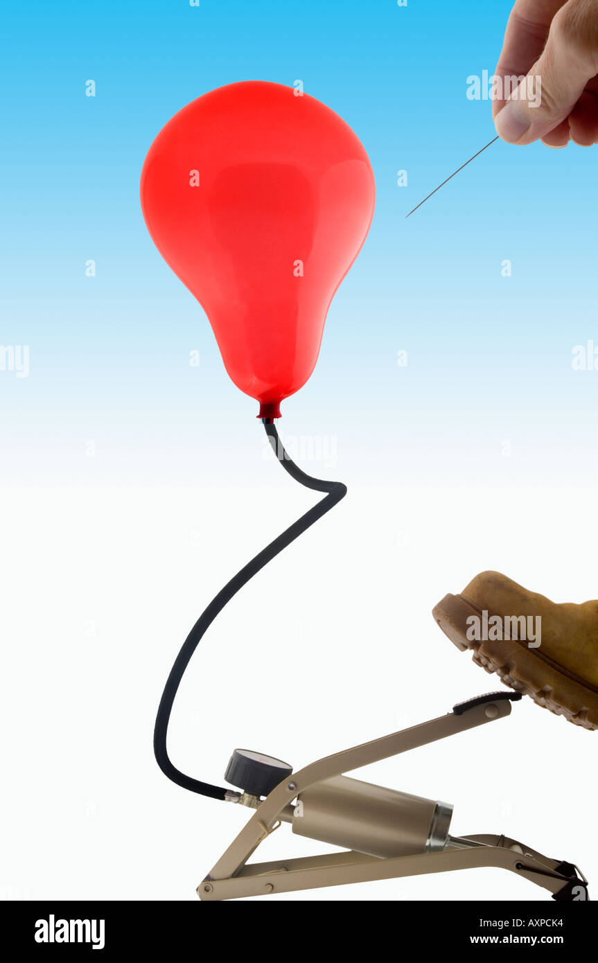 balloon pumped up by a footpump burst by a needle Stock Photo - Alamy