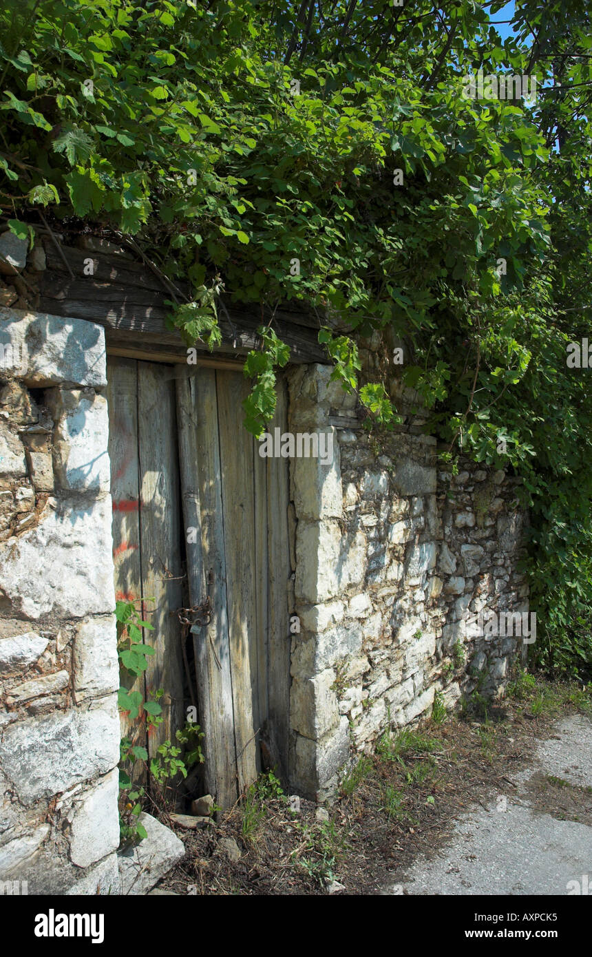 A rustic wooden gate set in the wall Stock Photo - Alamy