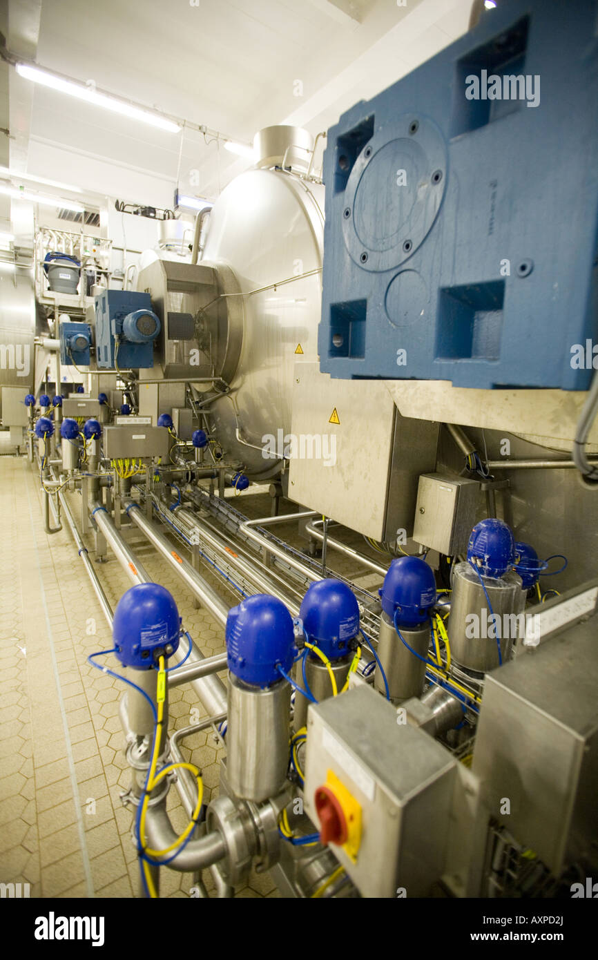 Cheese making drums. Cheese factory processing plant. drums and pipes ...