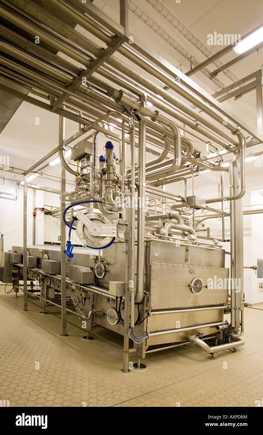 Cheese making drums. Cheese factory processing plant. drums and pipes ...