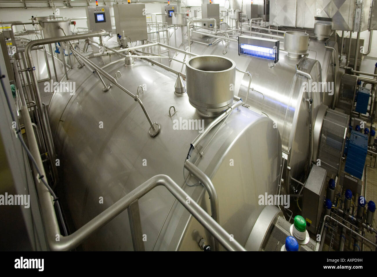 Large drums tanks Cheese factory processing plant. drums and pipes ...