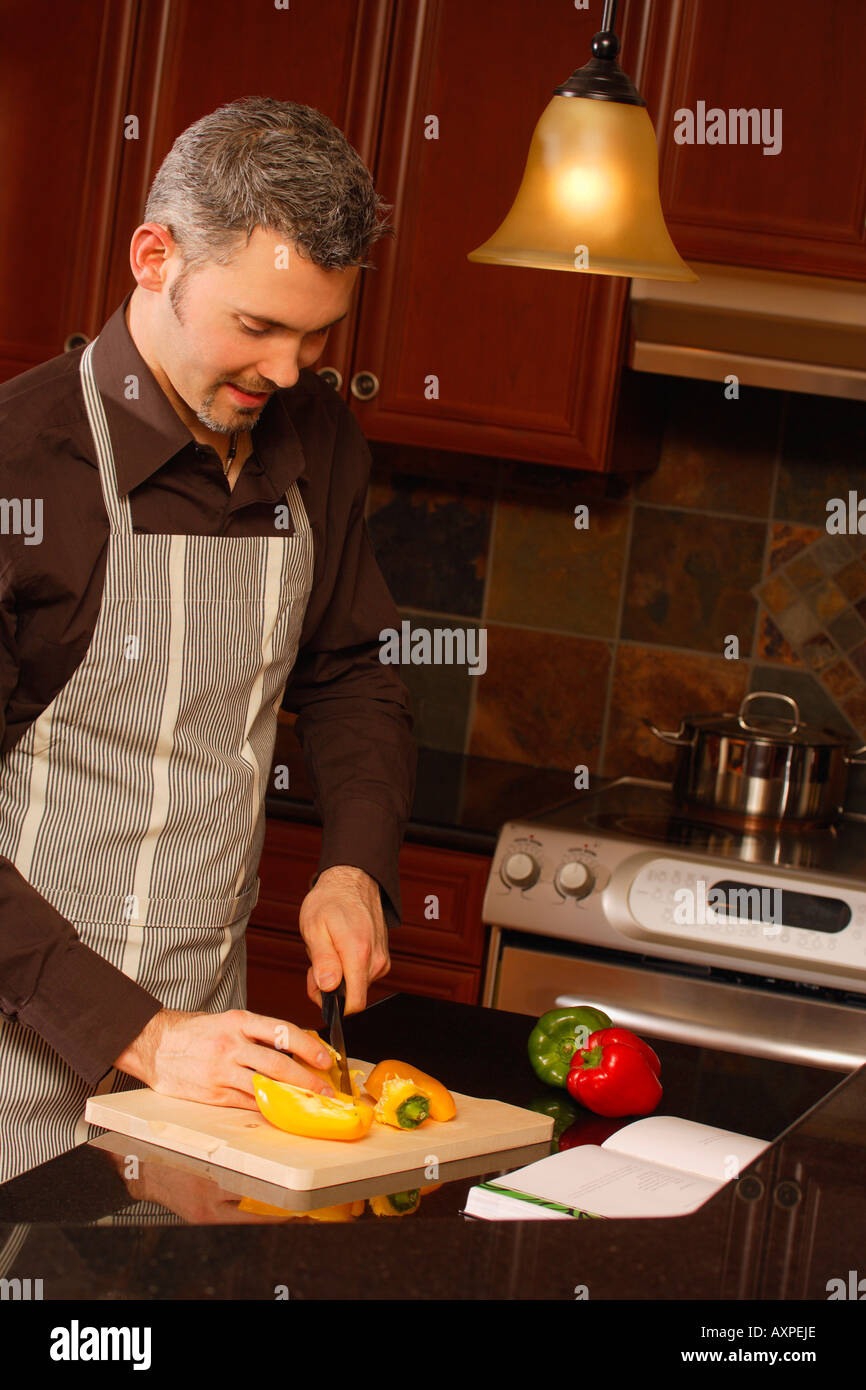 Man cooking in kitchen Stock Photo - Alamy