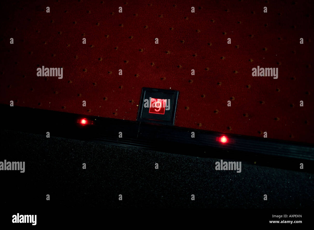 lighted level meter of an elevator displaying number nine Stock Photo ...