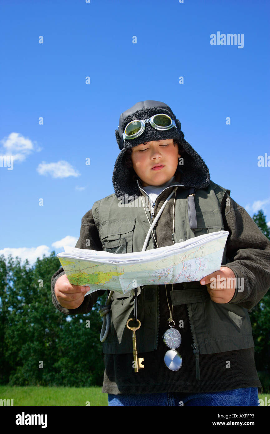 Young explorer reading a map Stock Photo - Alamy