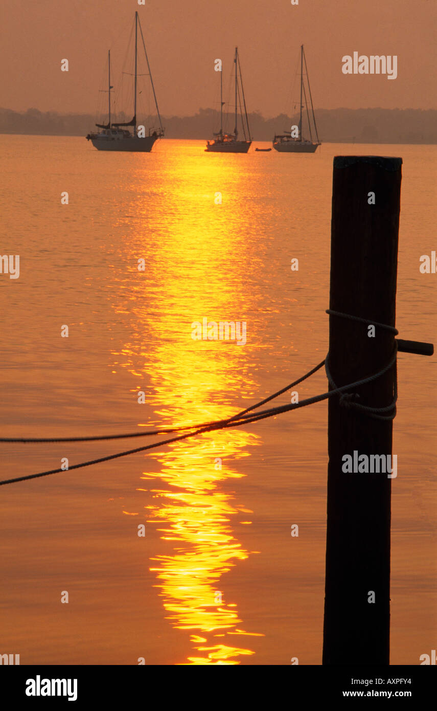 Sailboats at sunset Stock Photo - Alamy