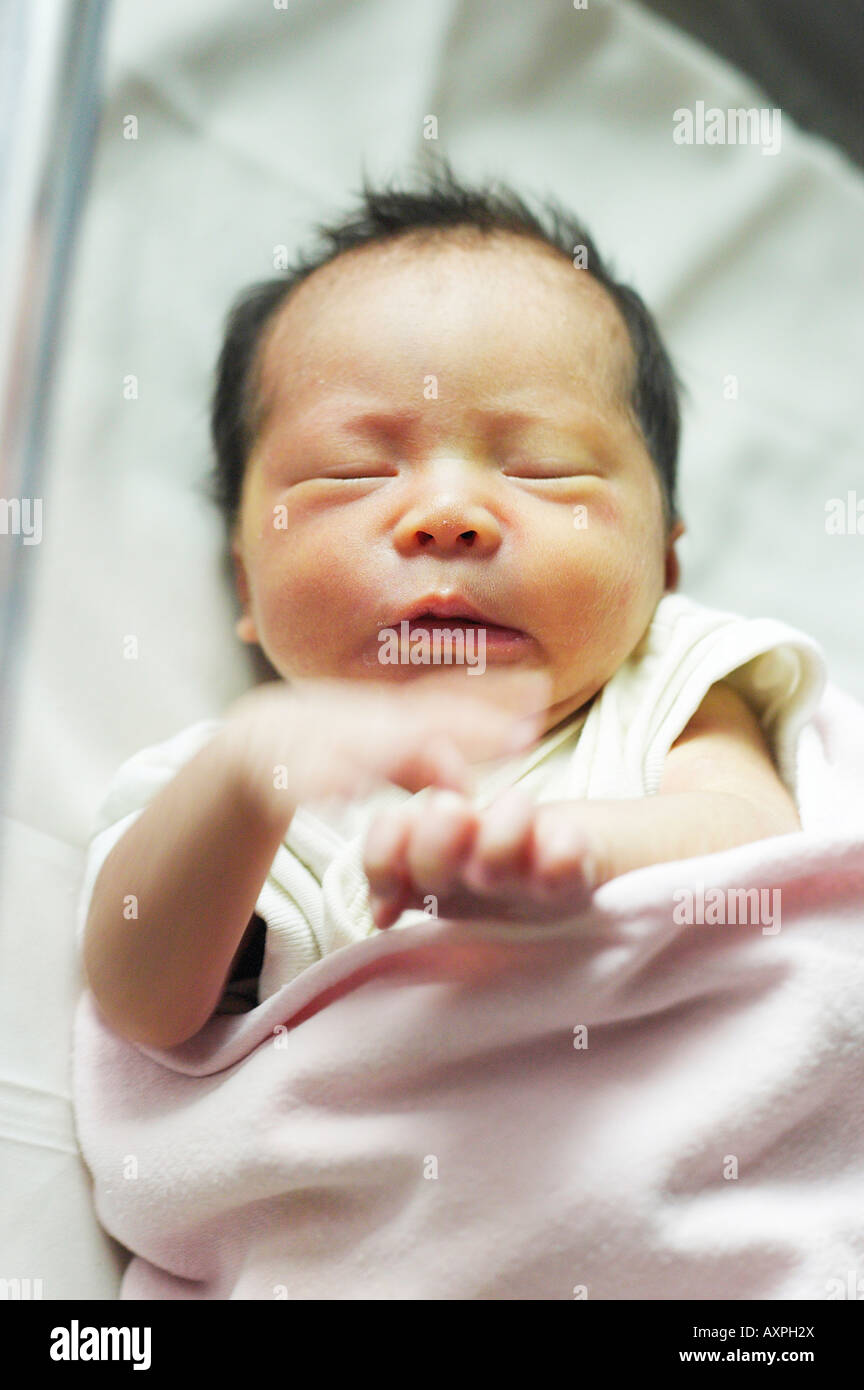 Baby stretch one arm Stock Photo - Alamy