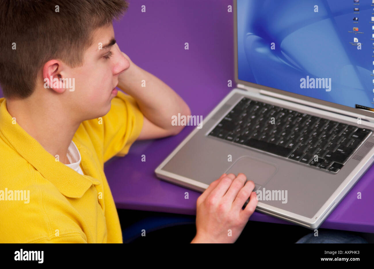 Teenage boy at laptop Stock Photo - Alamy