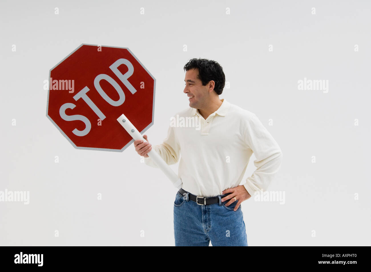 Man holding stop sign Stock Photo - Alamy