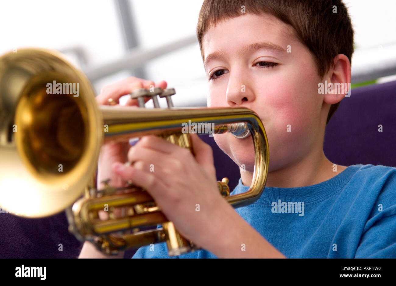 Boy playing trumpet Stock Photo - Alamy