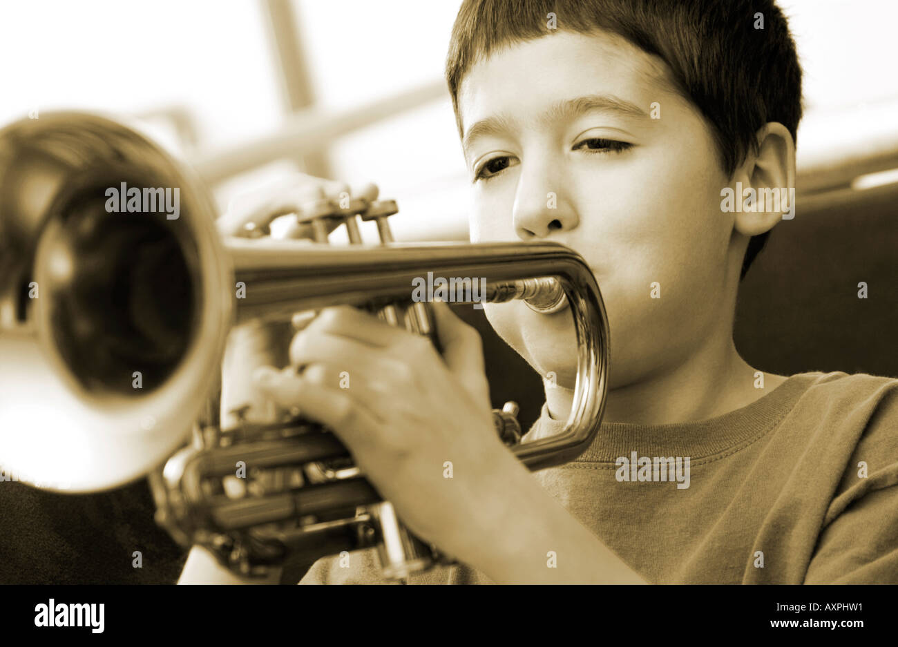 Boy playing trumpet Stock Photo - Alamy