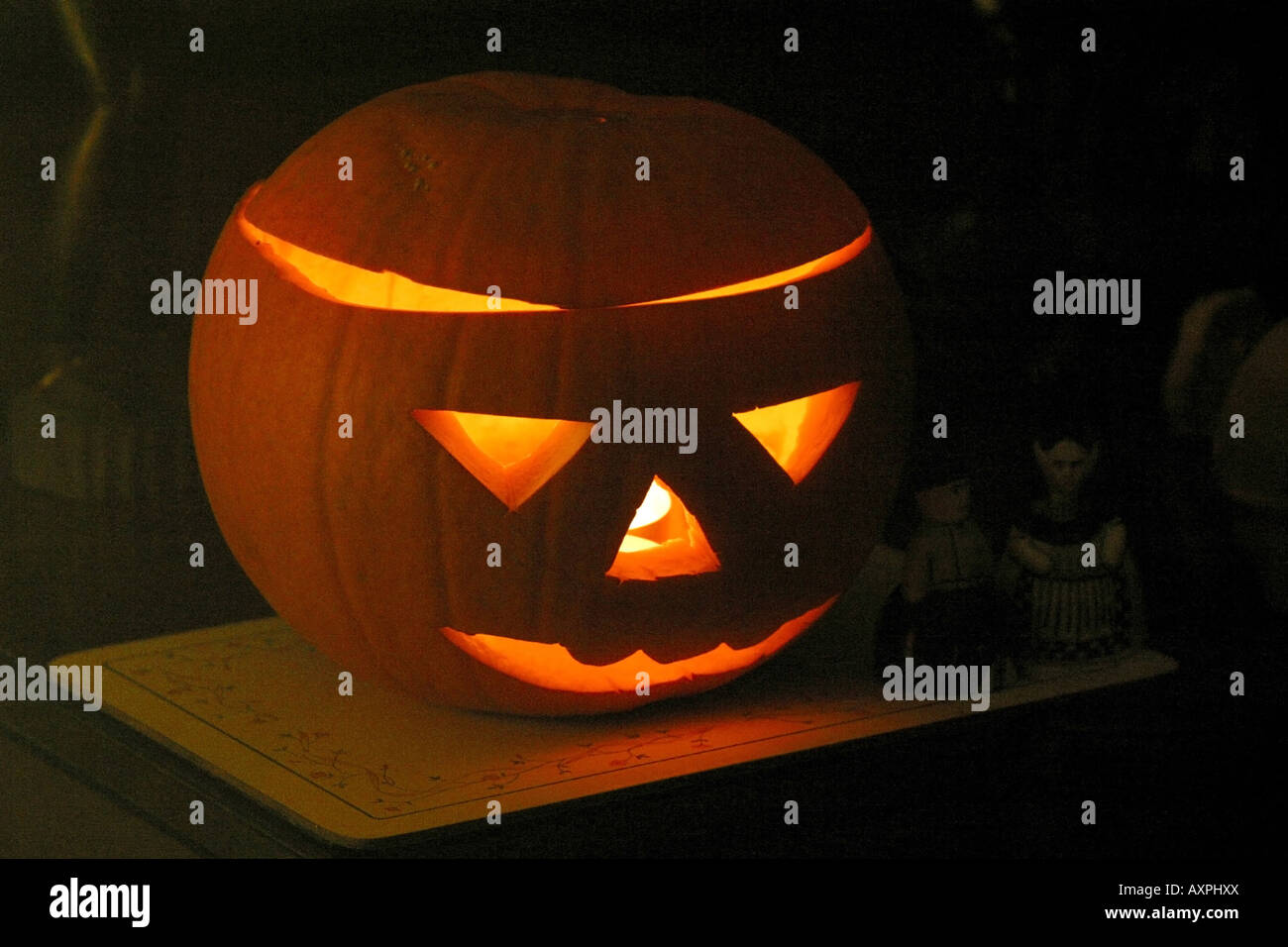 Carved pumkin glowing in the dark Stock Photo - Alamy