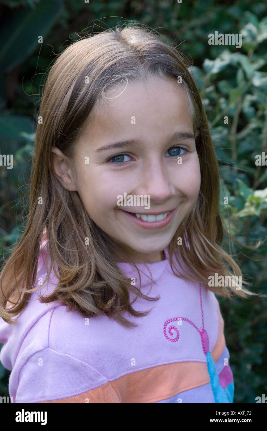 young girl smiling cheekily Stock Photo - Alamy