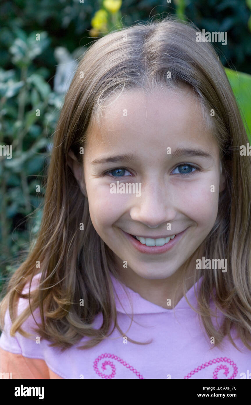 young girl smiling cheekily Stock Photo - Alamy