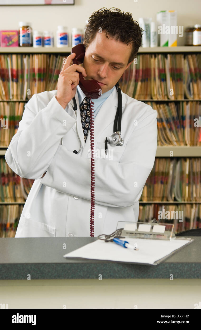 Doctor on telephone hi-res stock photography and images - Alamy