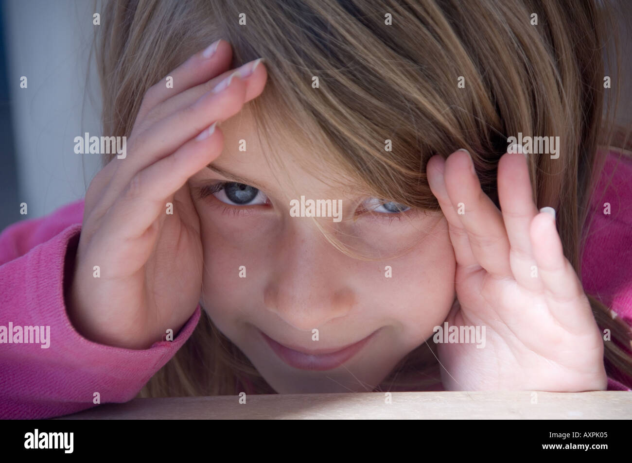 seven year old little girl with cheeky look Stock Photo - Alamy