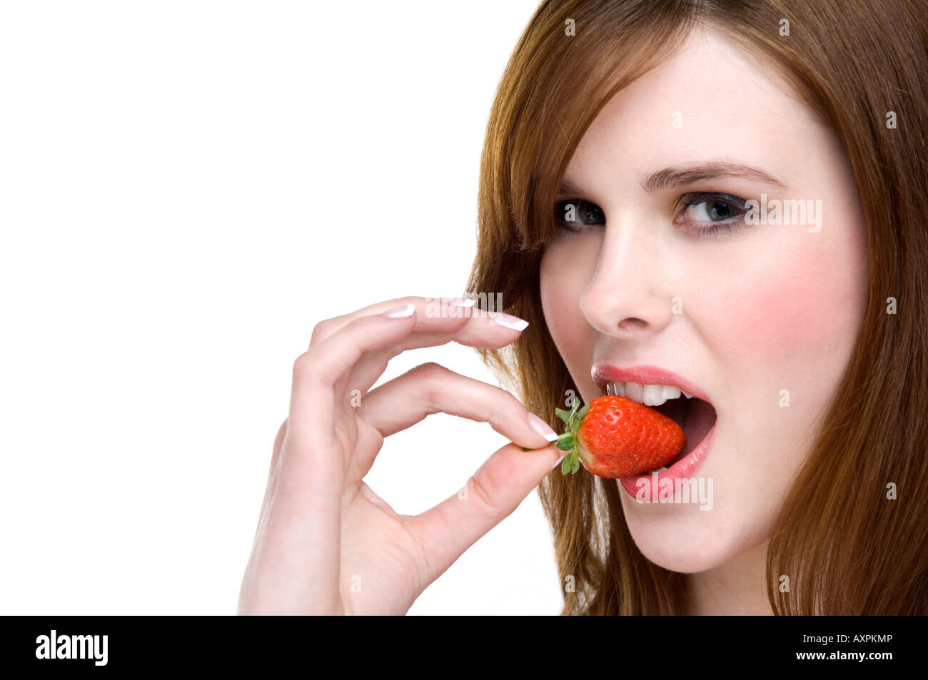 woman eating a strawberry fruit Stock Photo - Alamy