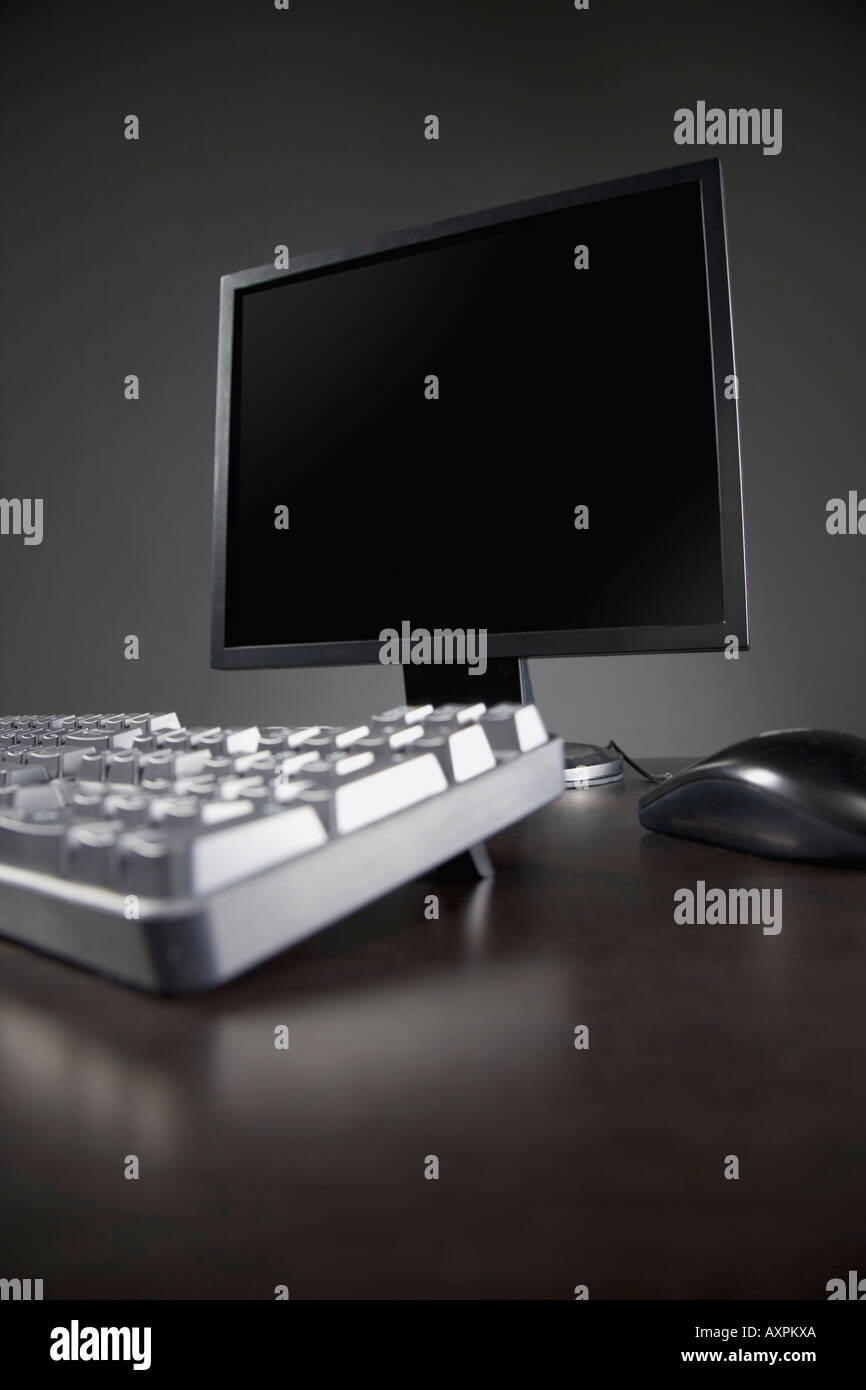 Flatscreen computer monitor with keyboard and mouse Stock Photo - Alamy