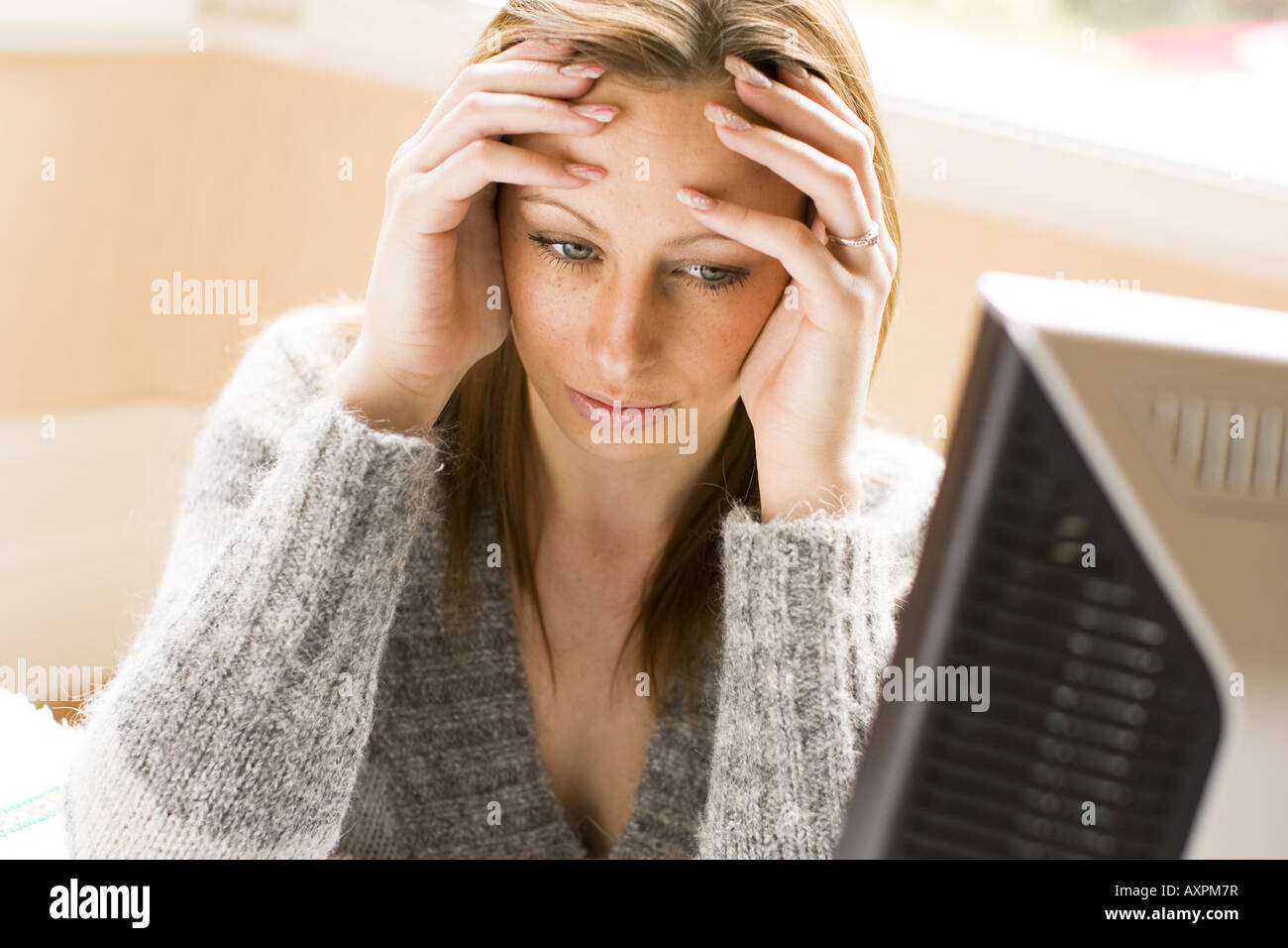 Frustrated woman using computer Stock Photo - Alamy