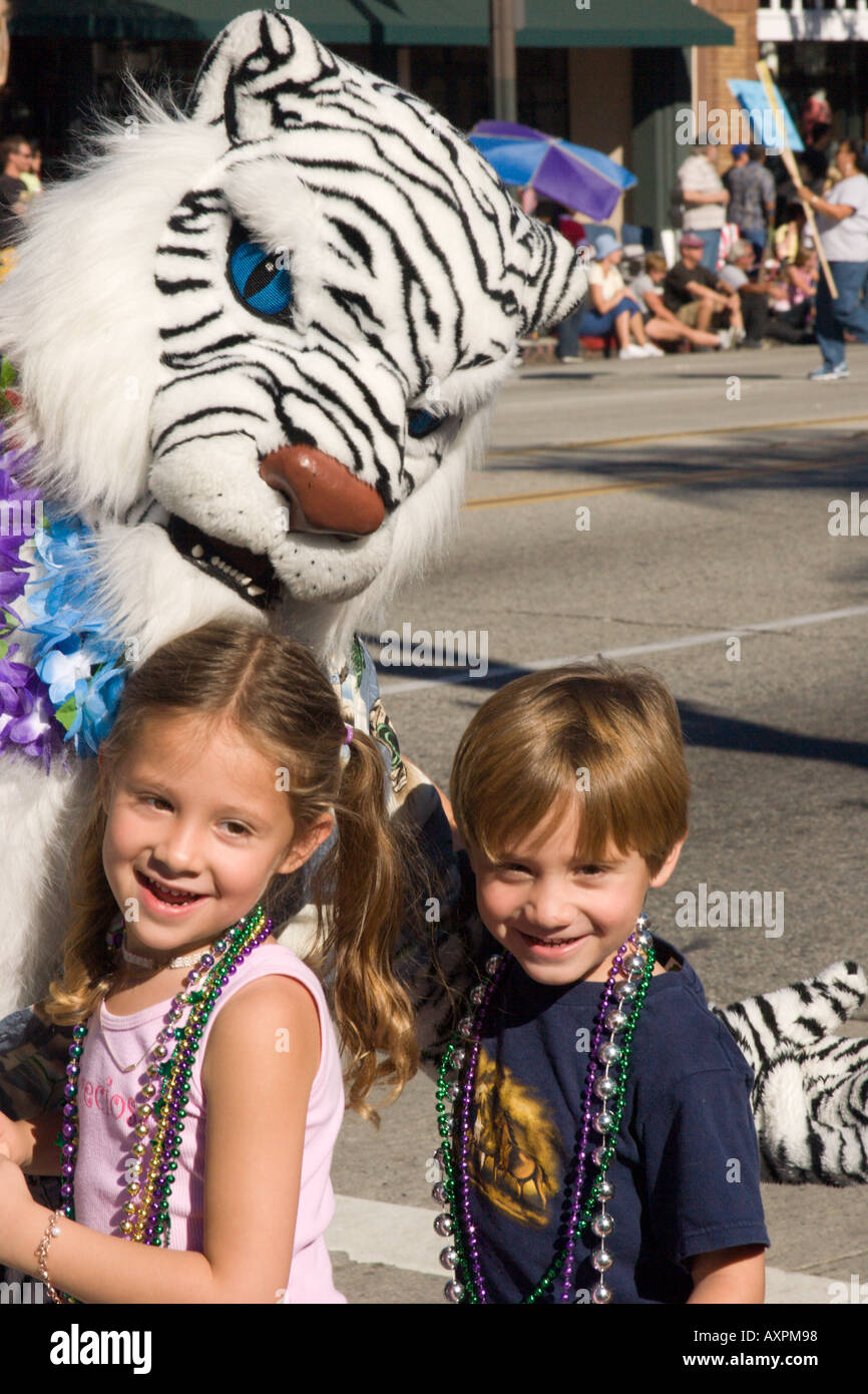 Brother and sister pose for photos with a tiger in the Doo Dah Parade ...