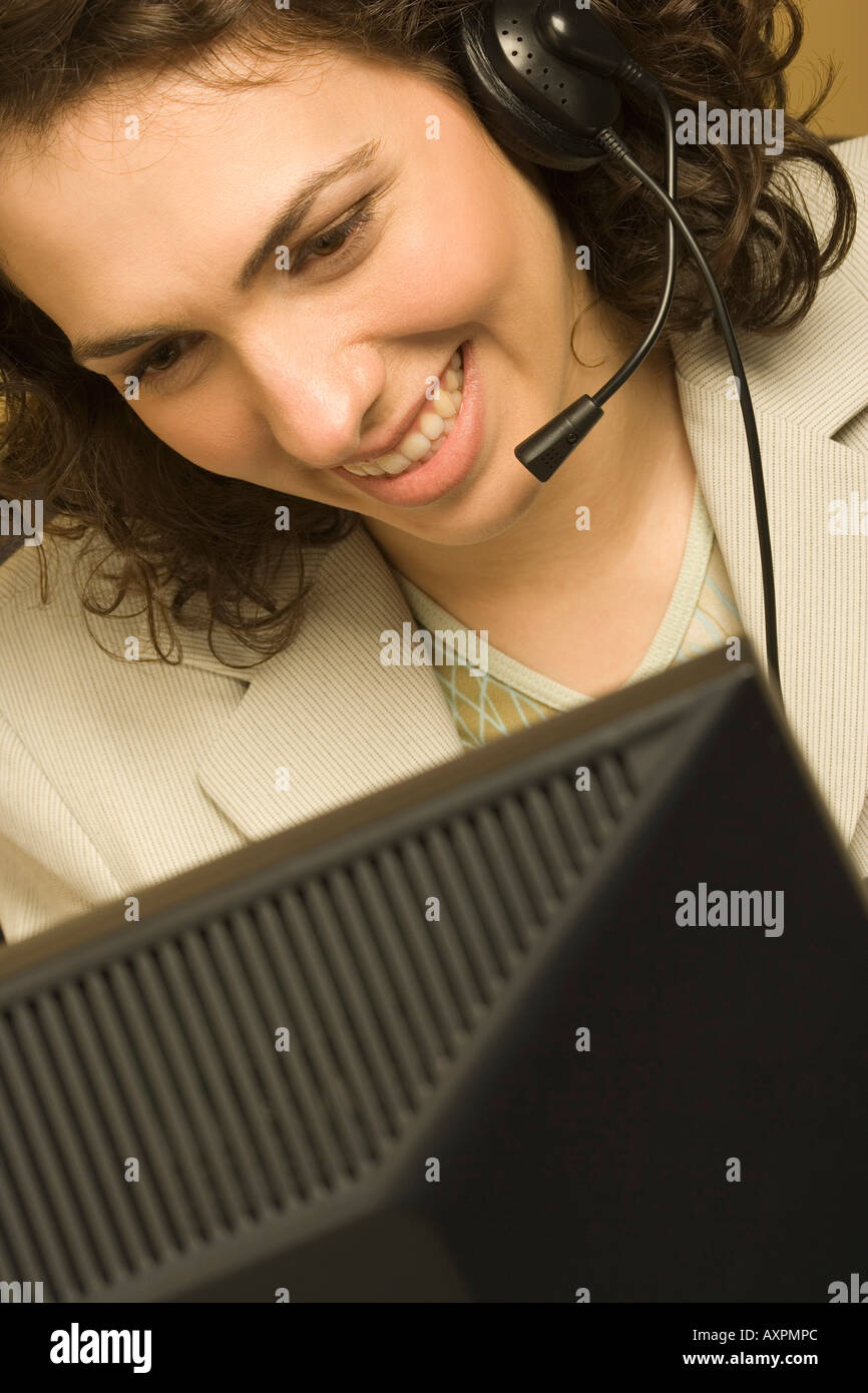 Business people headsets using computers hi-res stock photography and ...