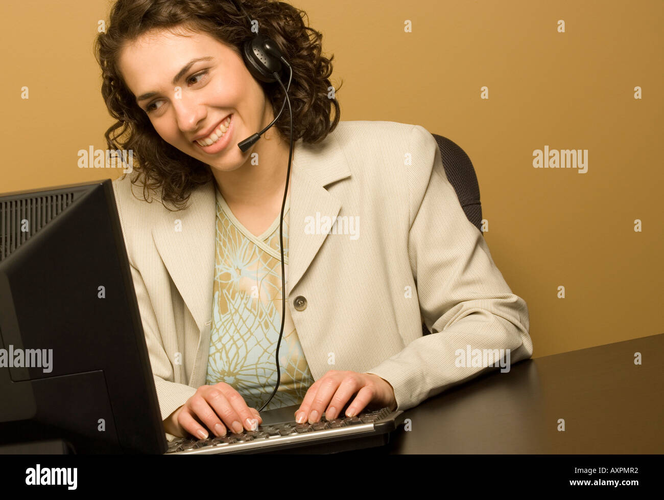 Woman Typing at desk Stock Photo - Alamy