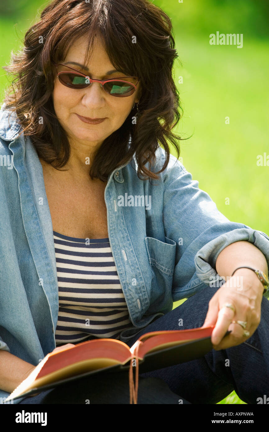 Person reading bible in park hi-res stock photography and images - Alamy