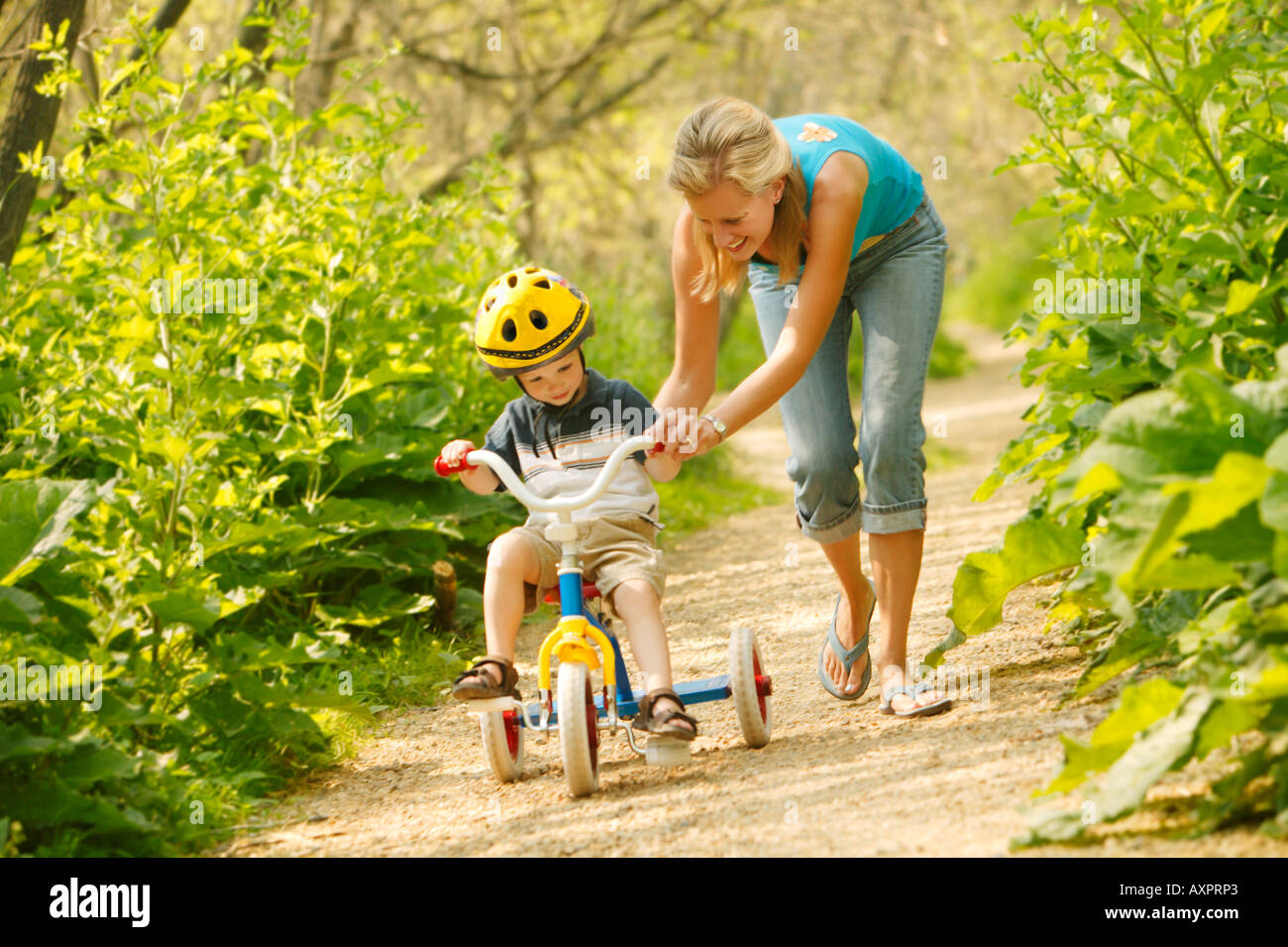 Learning to ride a bike Stock Photo - Alamy