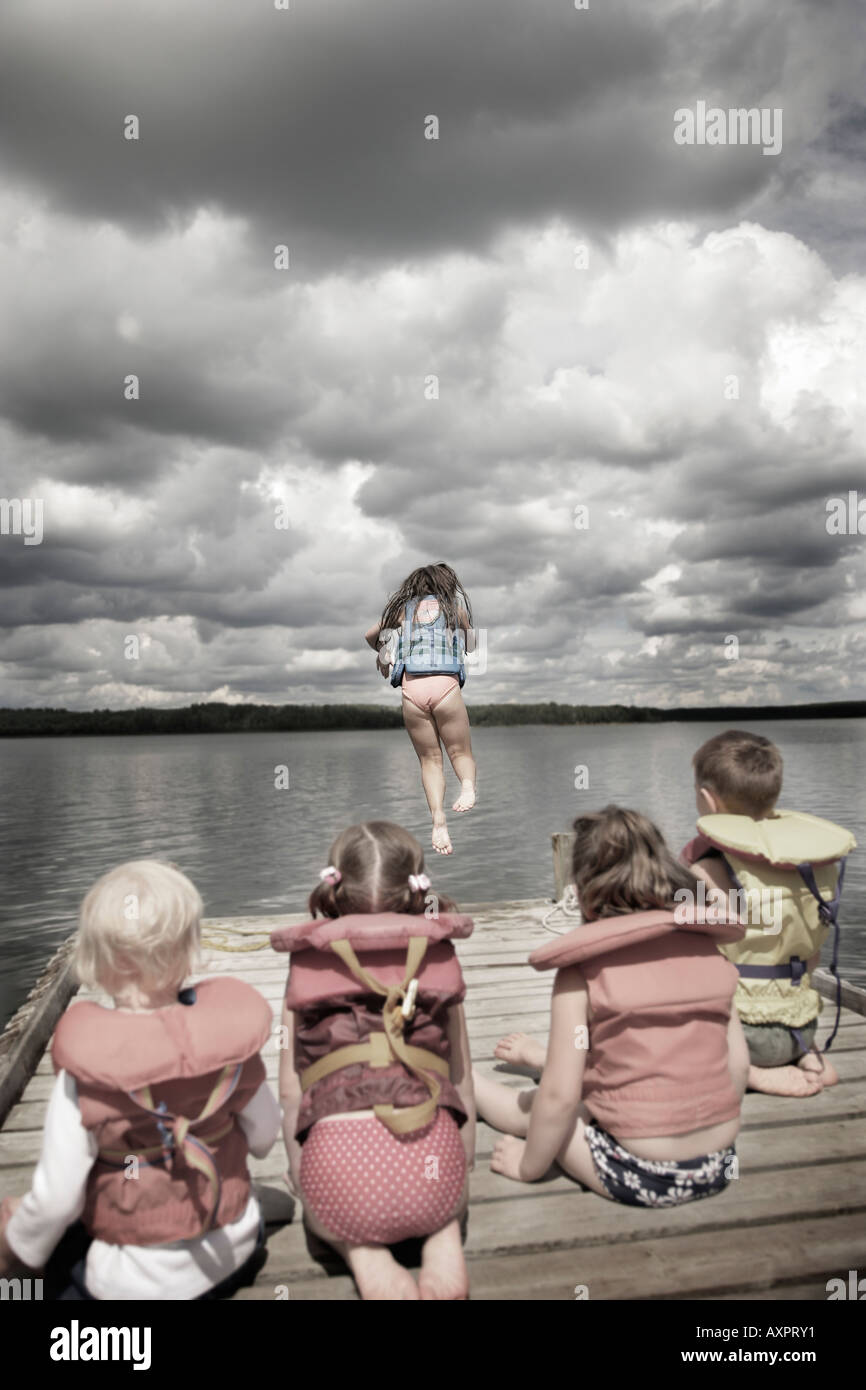 Children watching first water jumper Stock Photo - Alamy